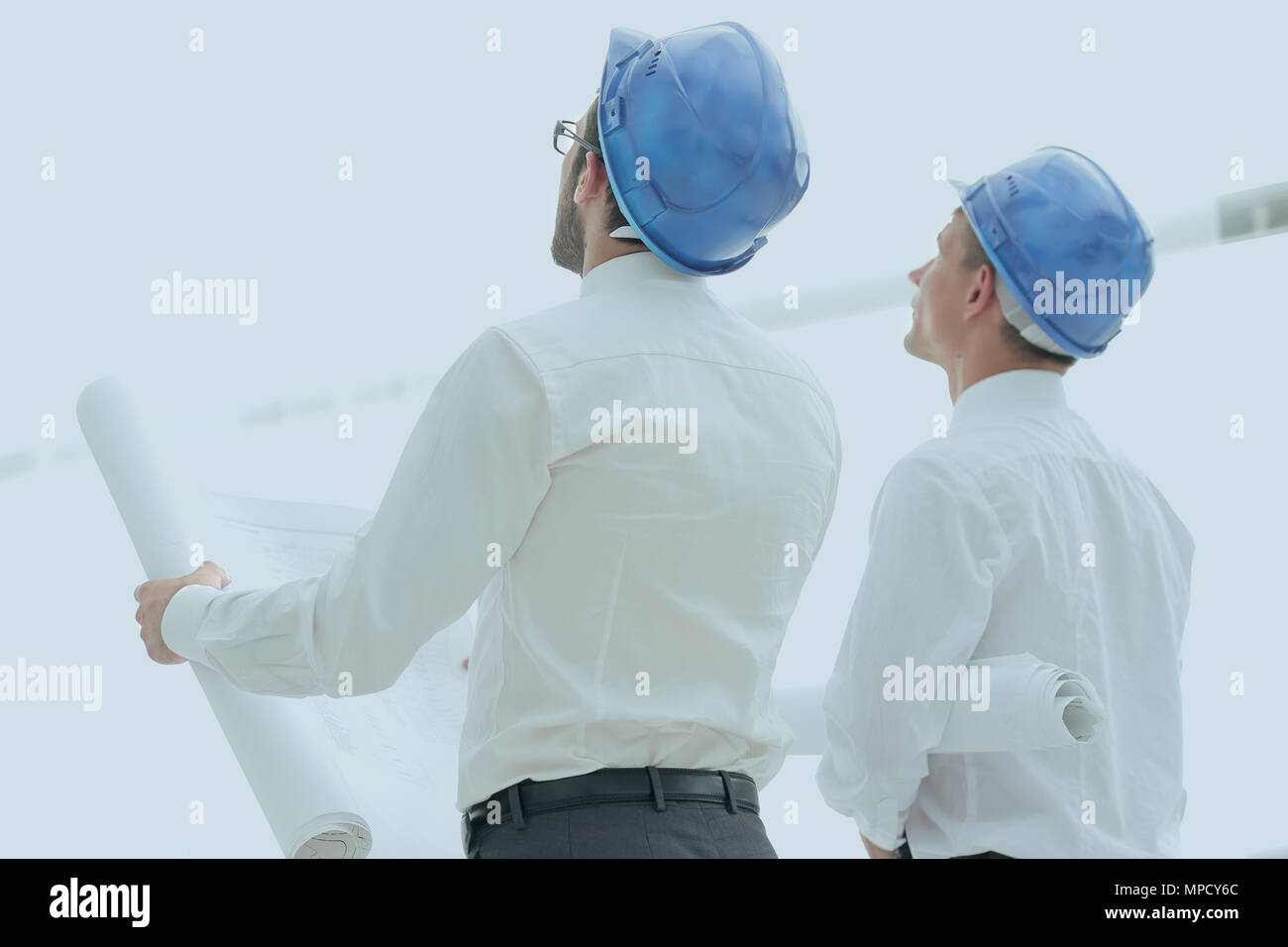 rear view.architect and Builder looking at blank screen Stock Photo - Alamy rear view.architect and Builder looking at blank screen Stock Photo - Alamy