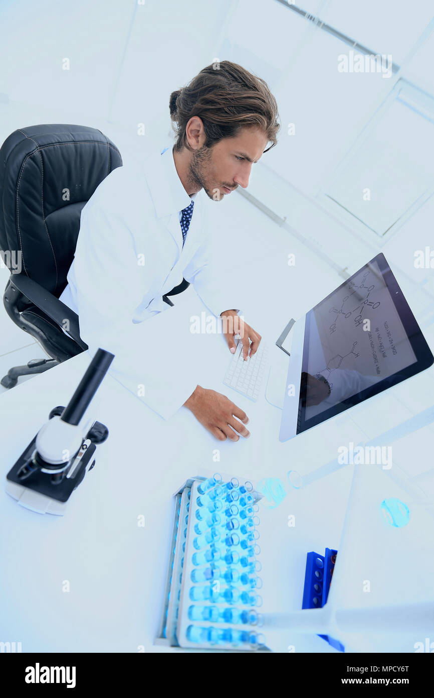 view from above of the scientist-doctor sitting on the computer Stock ...