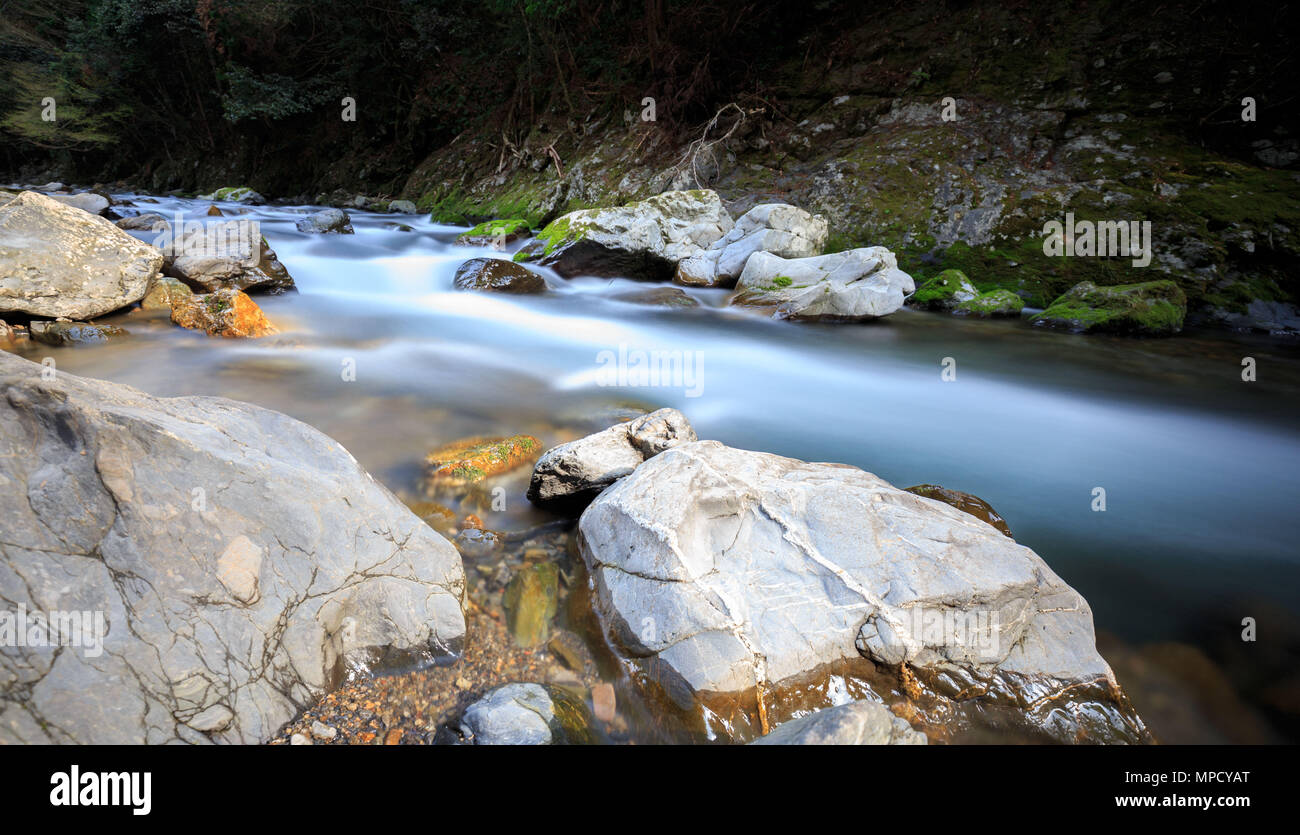 Water from small mountain river blurred as it moves downstream Stock ...