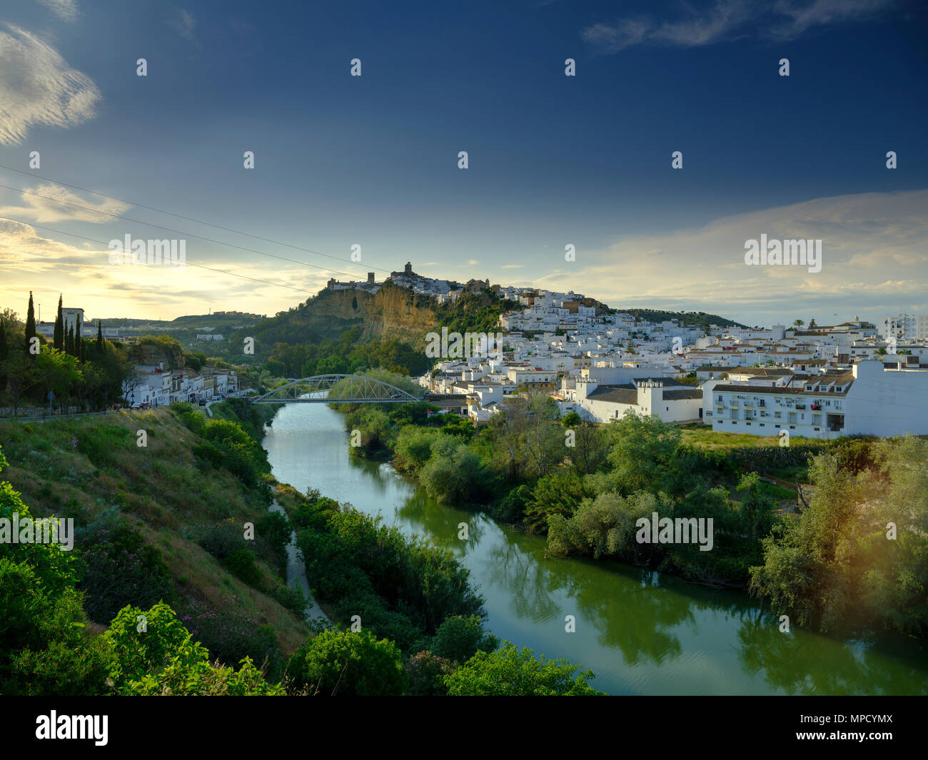 Early evening sunset light falling on the town of Arcos de La Frontera ...