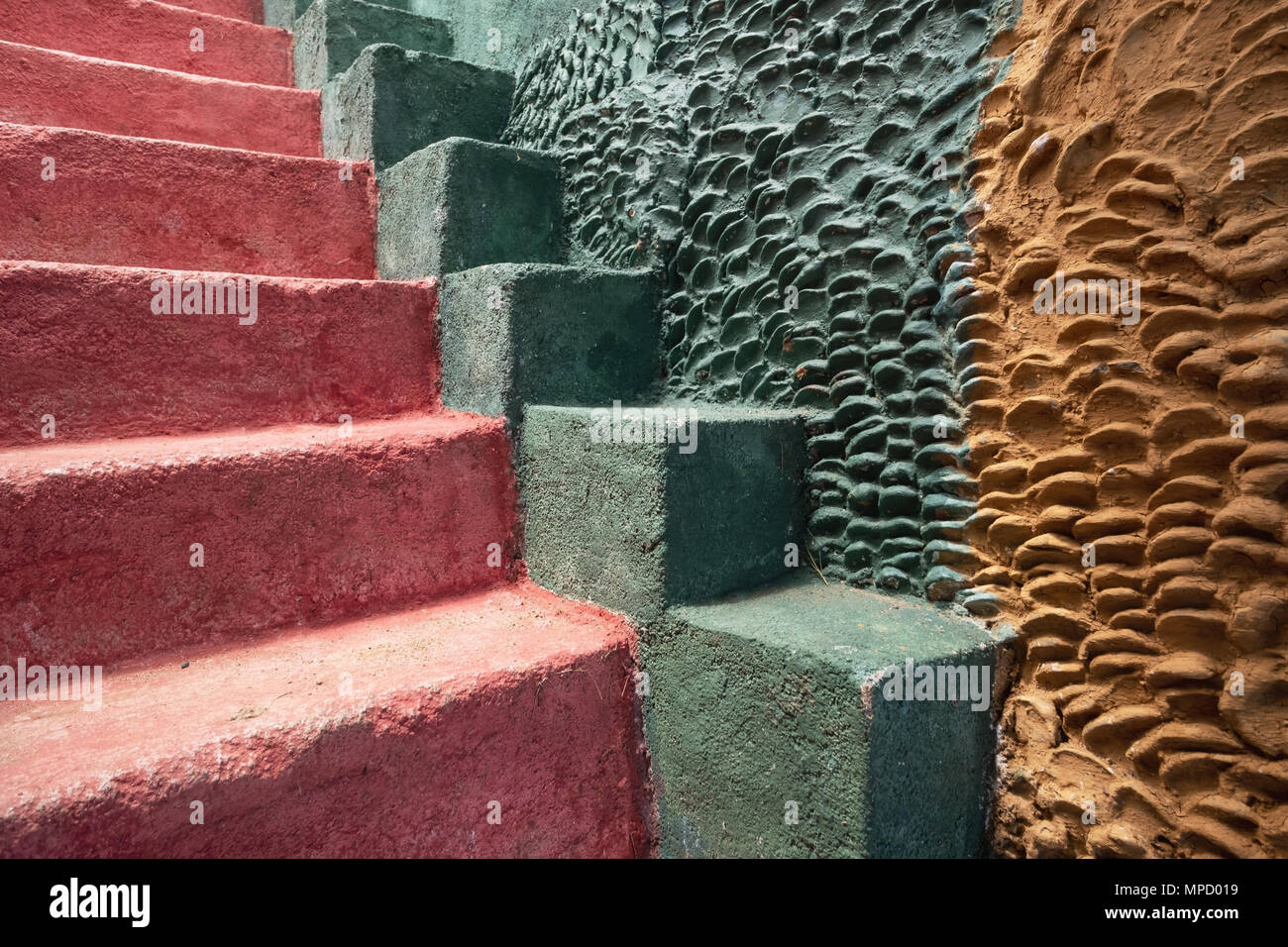 Outdoor stairs of green and red color Stock Photo - Alamy