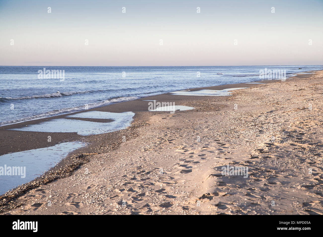 The deserted fairy tale beach with golden sand and blue water on the ...