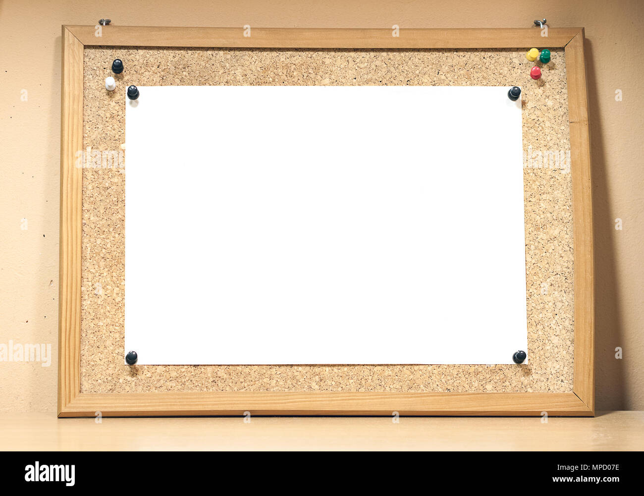 A cork board with a white sheet of paper. Background for mockup. Place ...