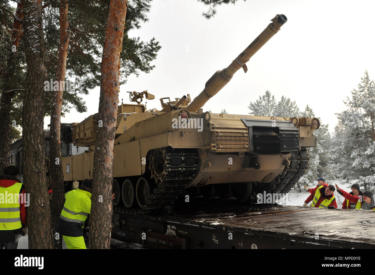 TRZBIEN, Poland – Railhead workers load an M1A2 Abrams tank, belonging ...