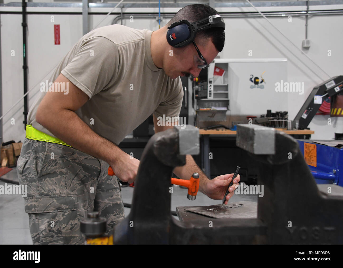U.S. Air Force Staff Sgt. Eric Kerr, a fabrication flight metals ...
