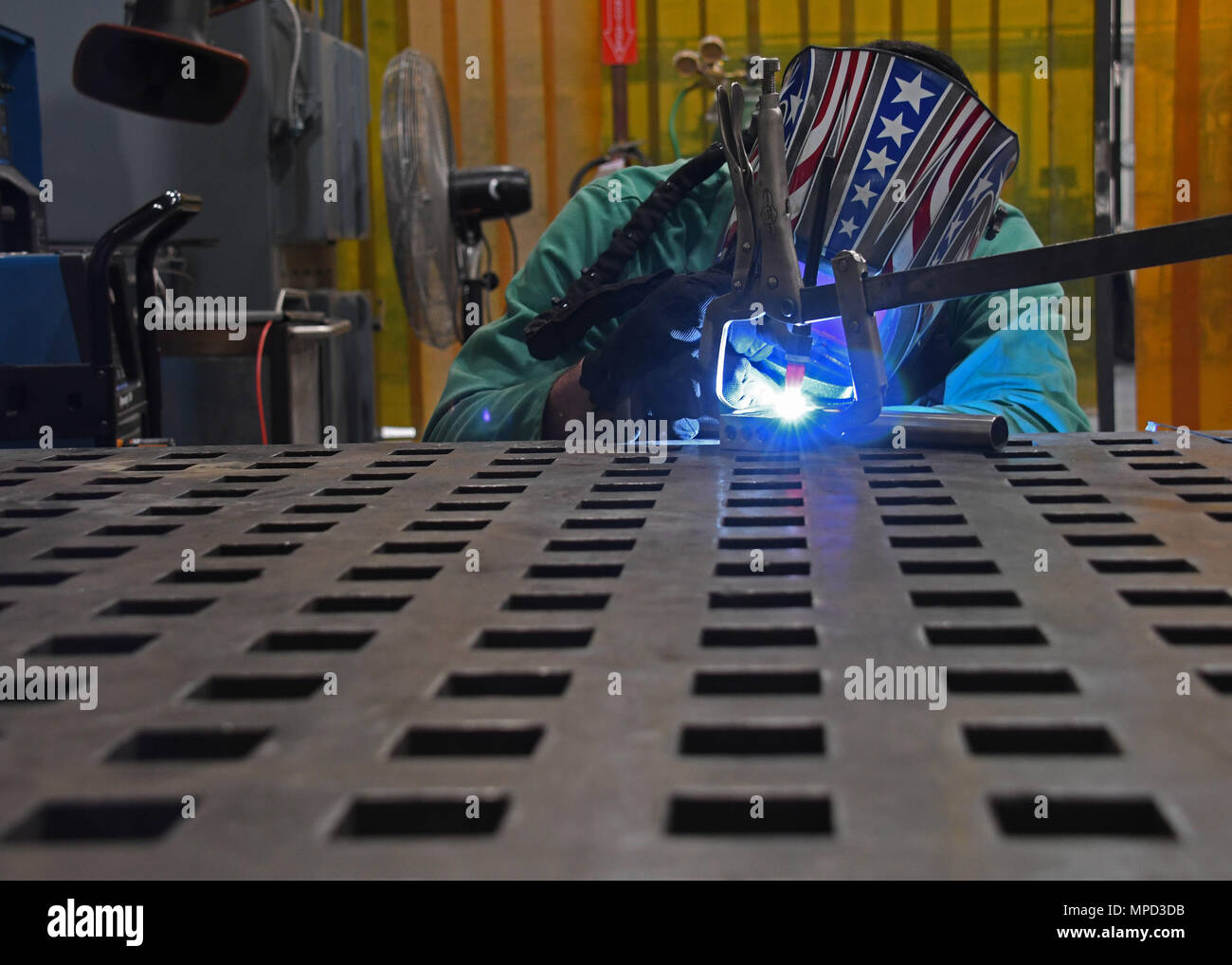 U.S. Air Force Staff Sgt. Eric Kerr, a fabrication flight metals ...