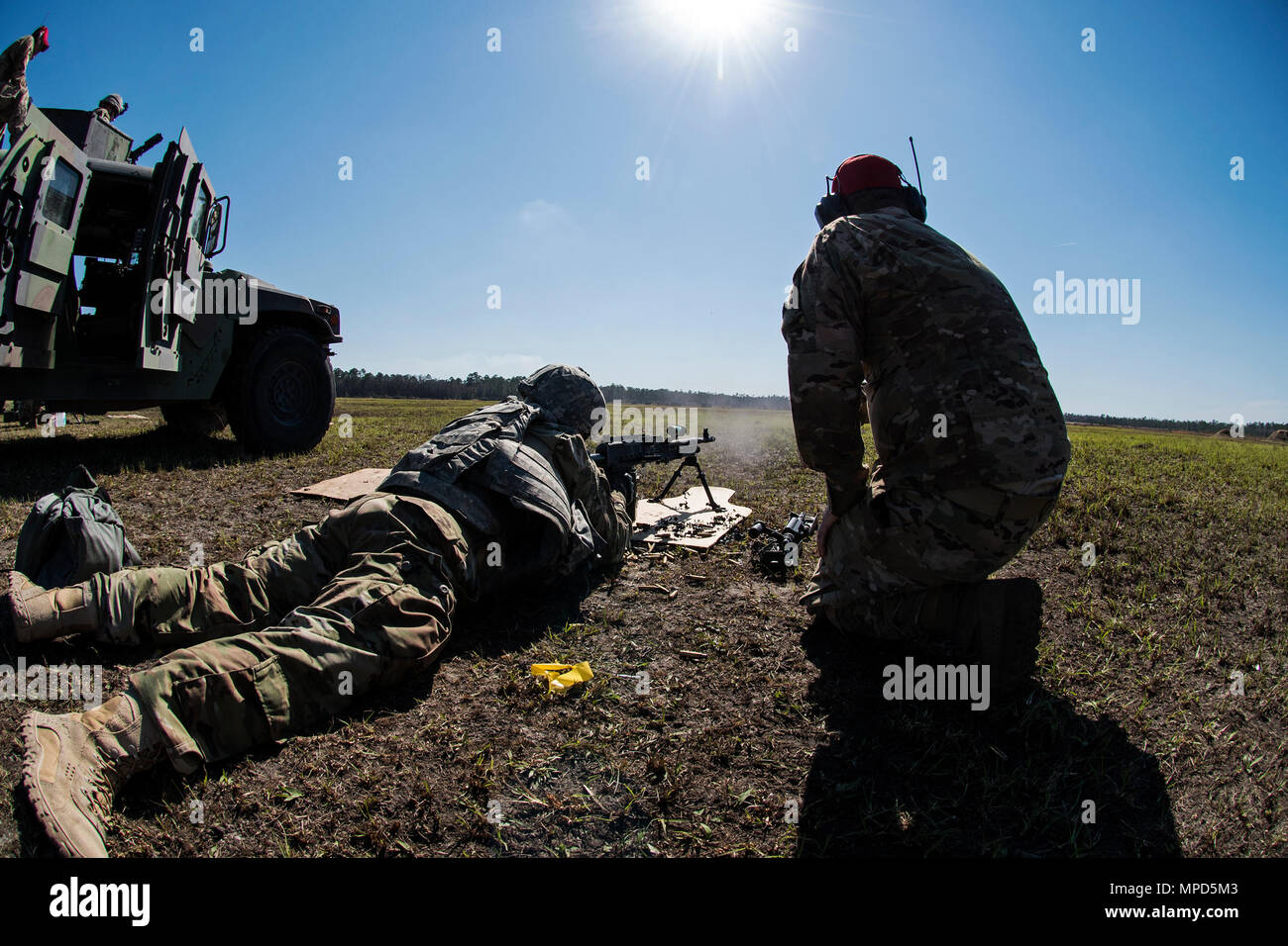 A fireteam member from the 822d Base Defense Squadron fires an M240B ...