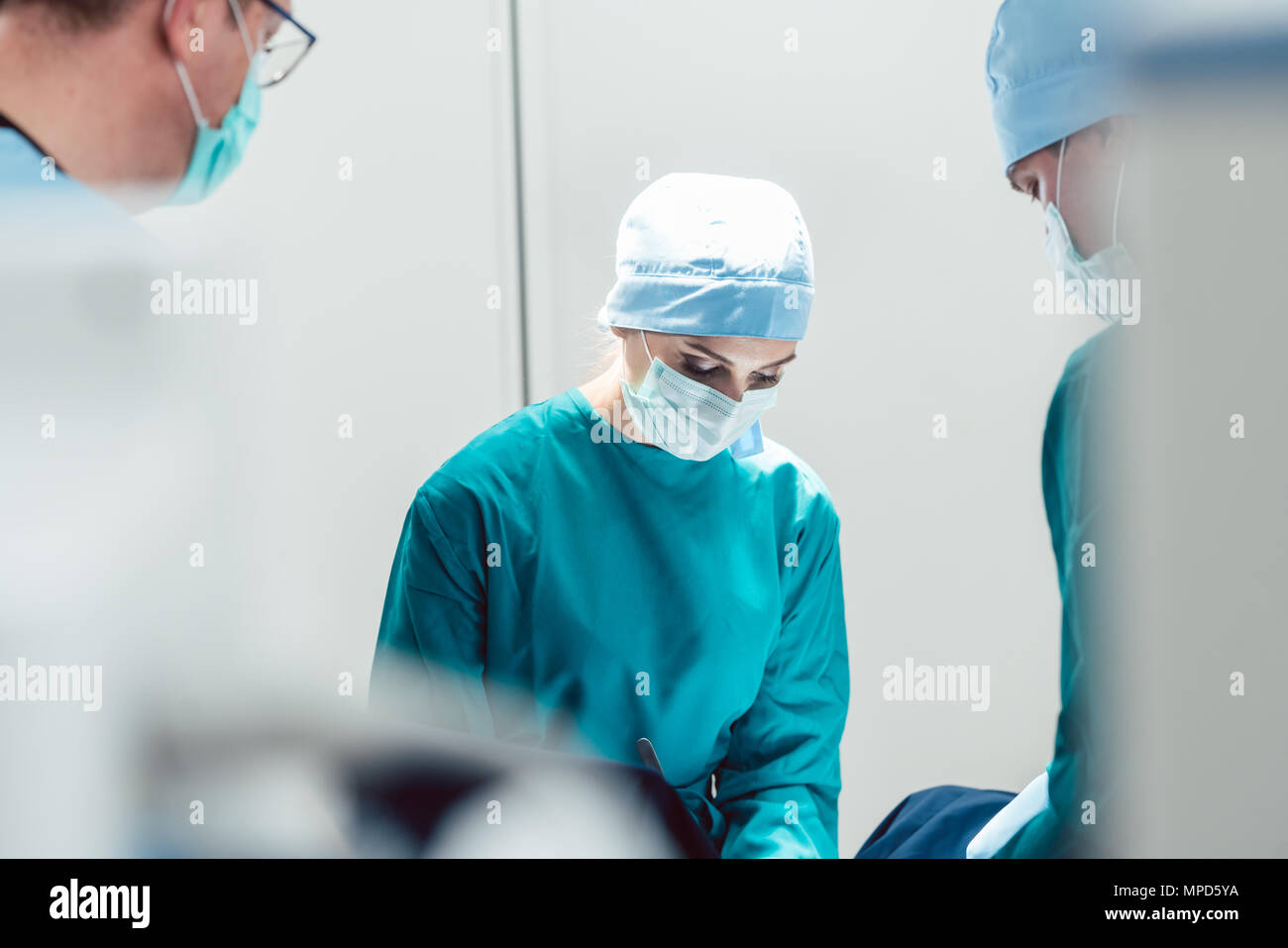 Surgeon operating in operation room of hospital Stock Photo - Alamy