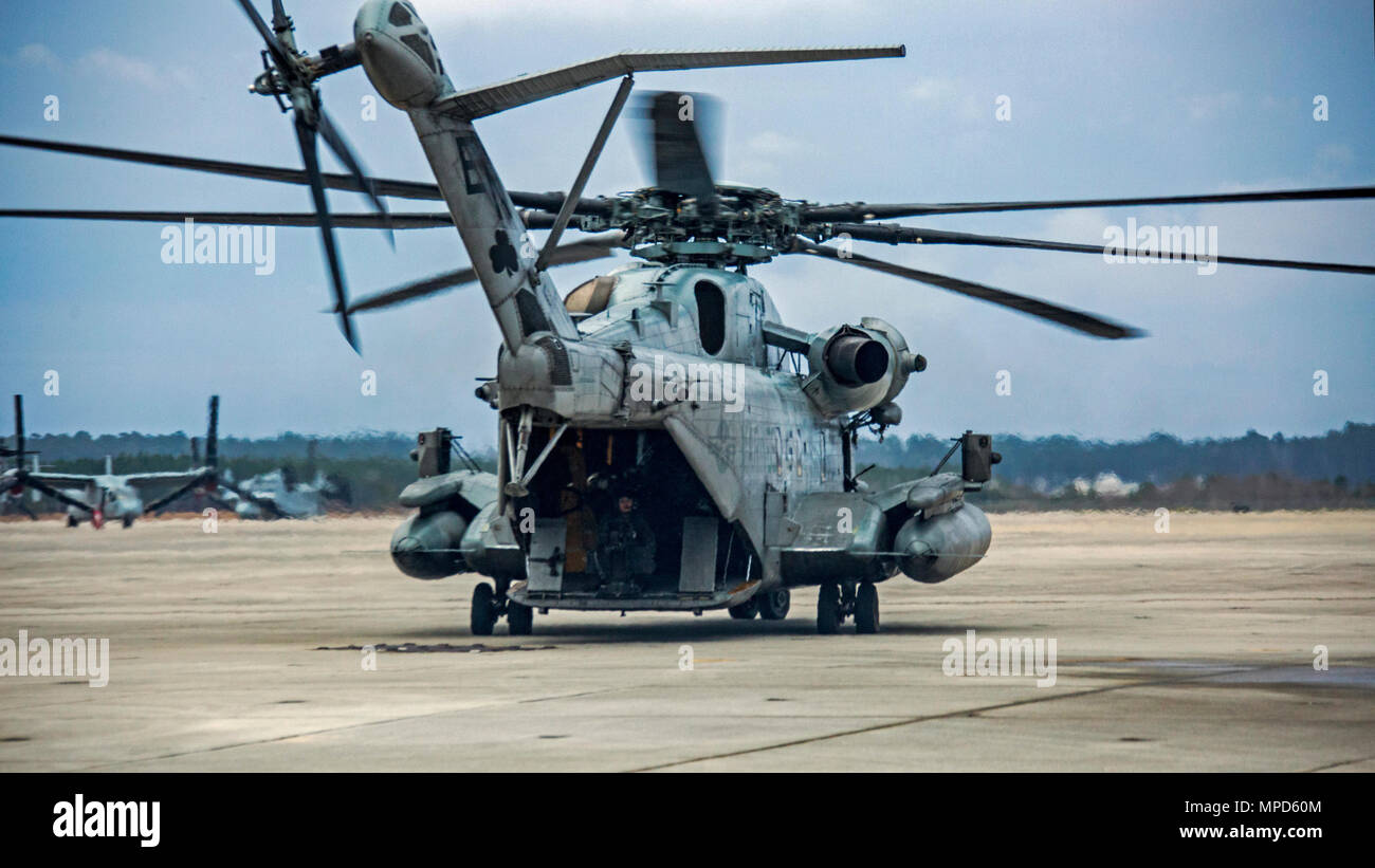 U.S. Marines with Marine Heavy Helicopter Squadron 464 taxi a CH-53E ...