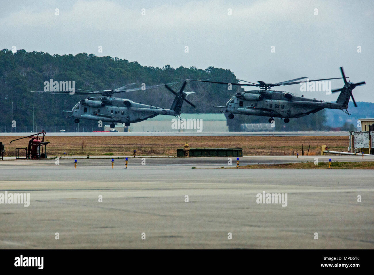 U.S. Marines with Marine Heavy Helicopter Squadron 464 hover CH-53E ...