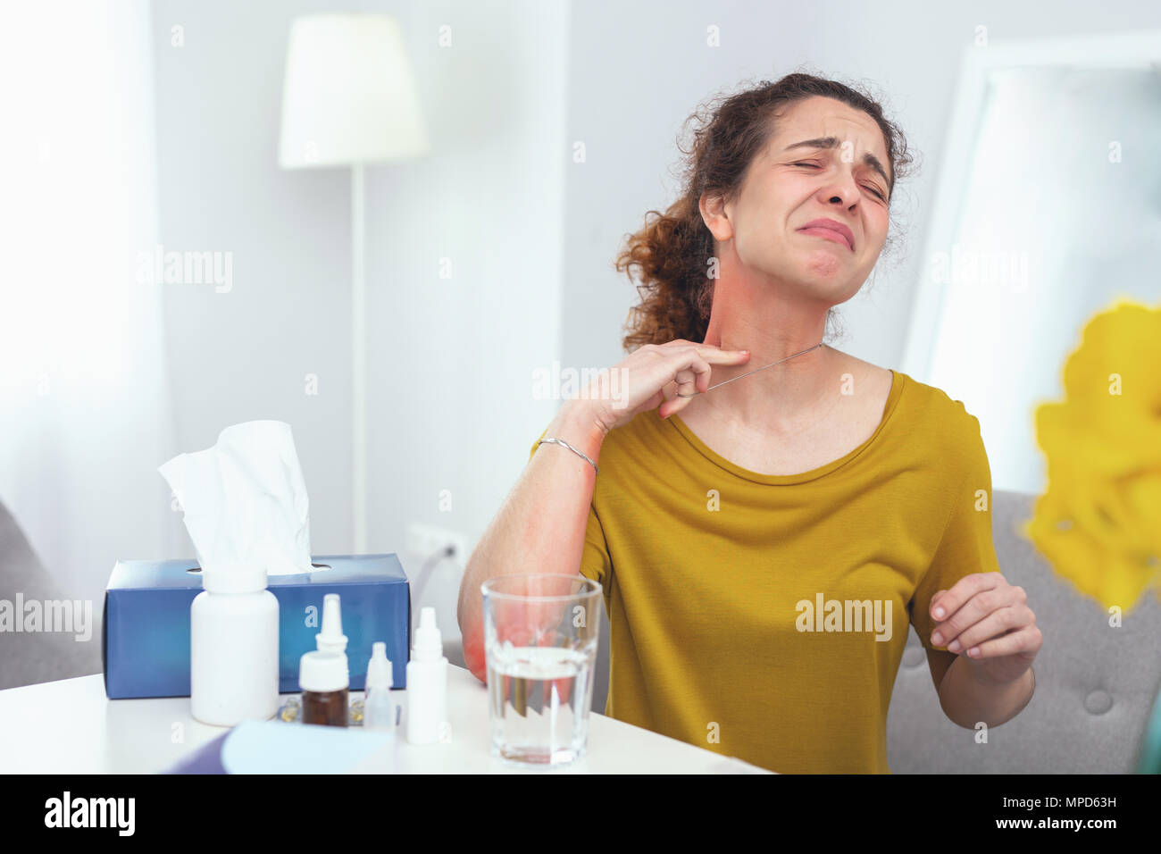 Young housewife discovering a rash from necklace Stock Photo - Alamy