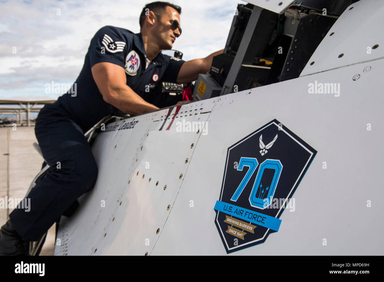Staff Sgt. Aaron Langley sets up the cockpit of a Thunderbirds F-16 at ...