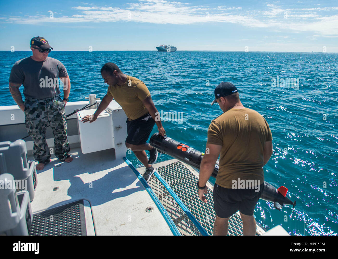 Service members assigned to Explosive Ordnance Disposal Mobile Unit ...