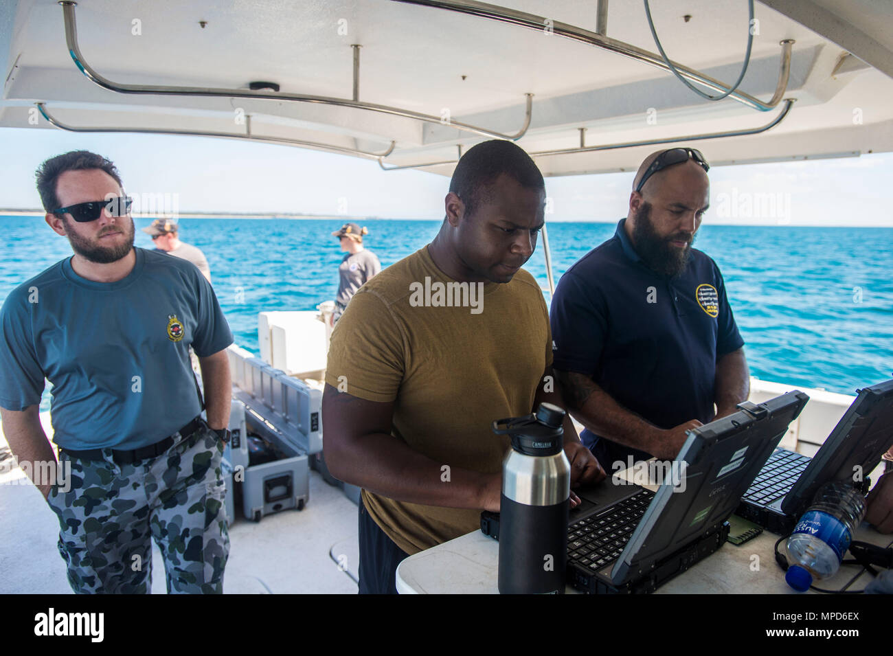 Service members assigned to Explosive Ordnance Disposal Mobile Unit ...