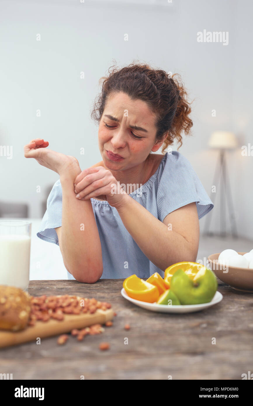 Adolescent woman experiencing distressing symptoms Stock Photo - Alamy
