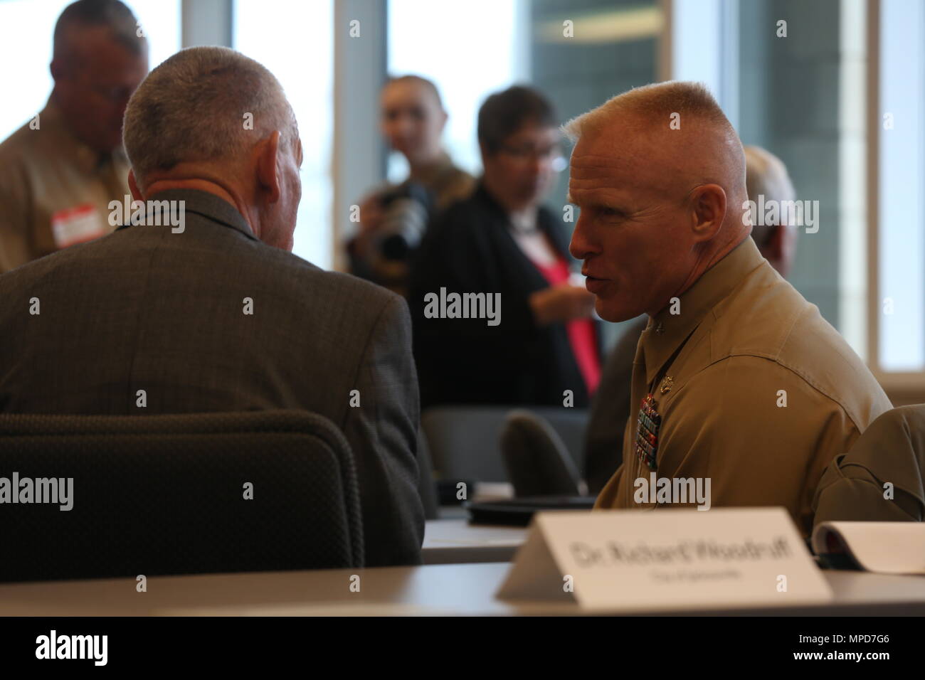 Brig. Gen. Thomas Weidley speaks with Richard Woodruff during the ...