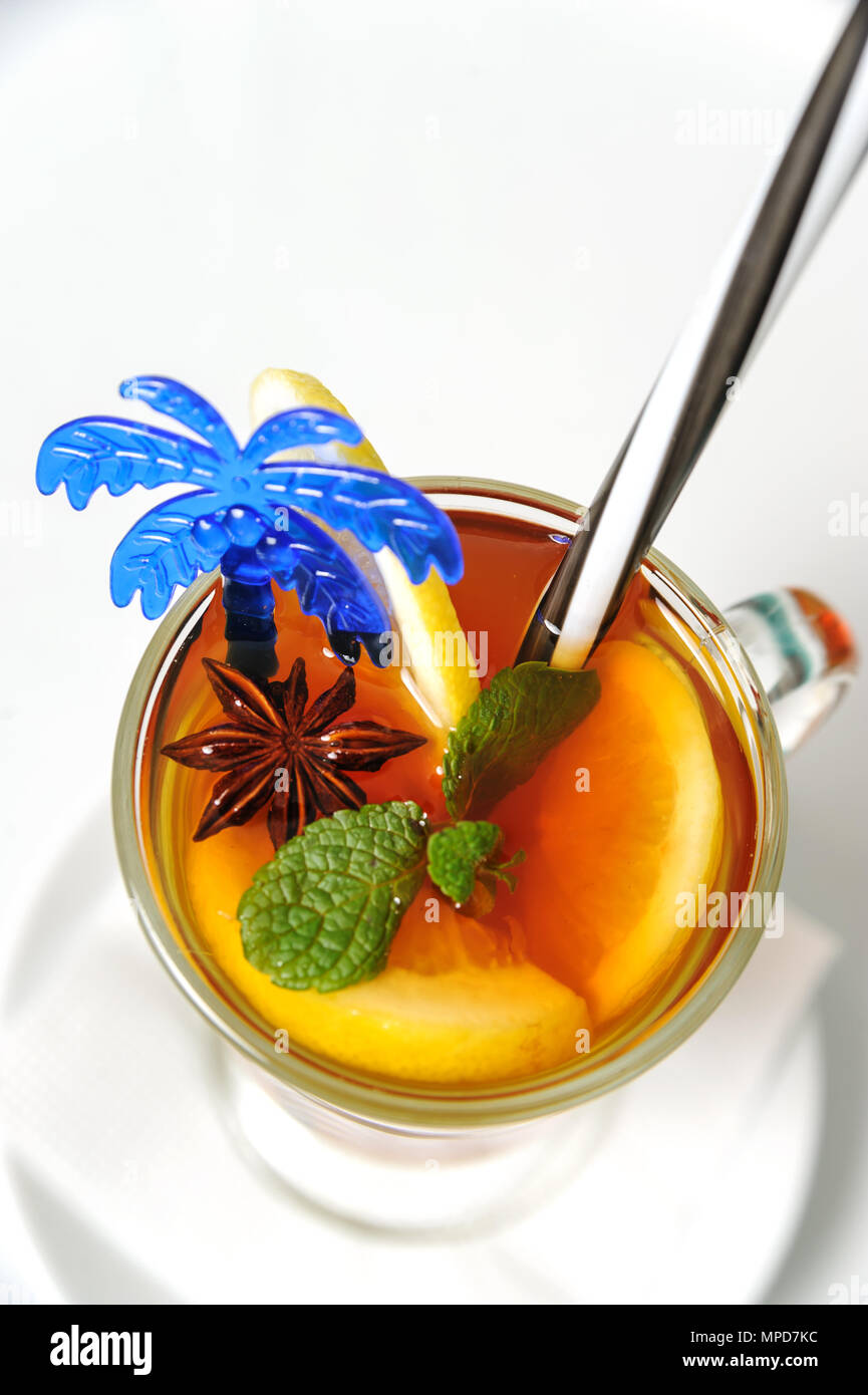 Grog in a glass mug decorated with orange slices and mint leaves Stock ...