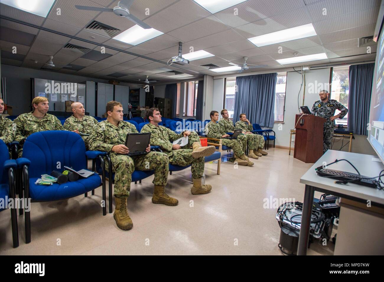 Service members assigned to Explosive Ordnance Disposal Mobile Unit ...