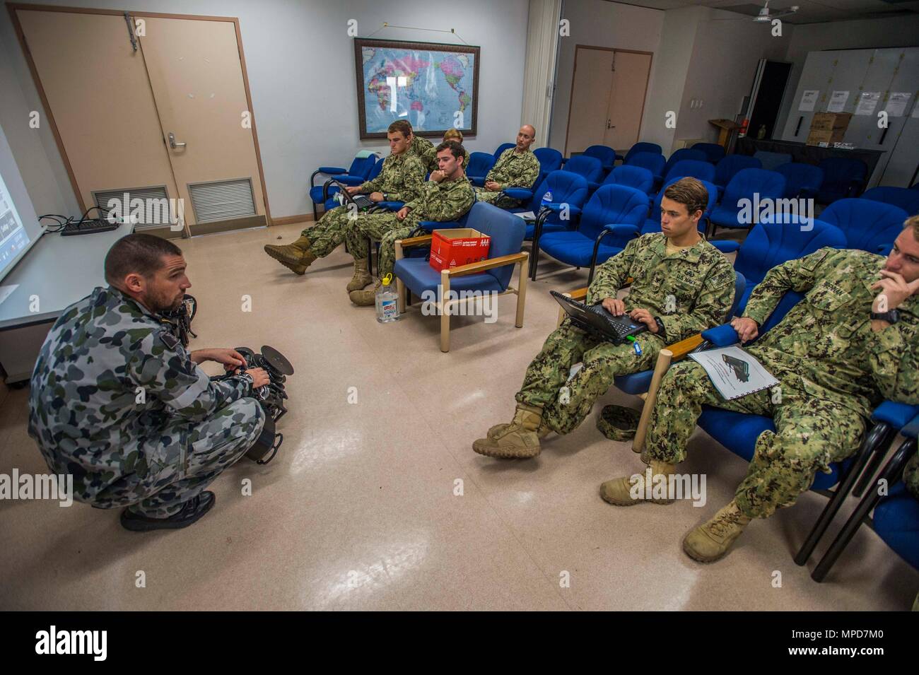 Service members assigned to Explosive Ordnance Disposal Mobile Unit ...