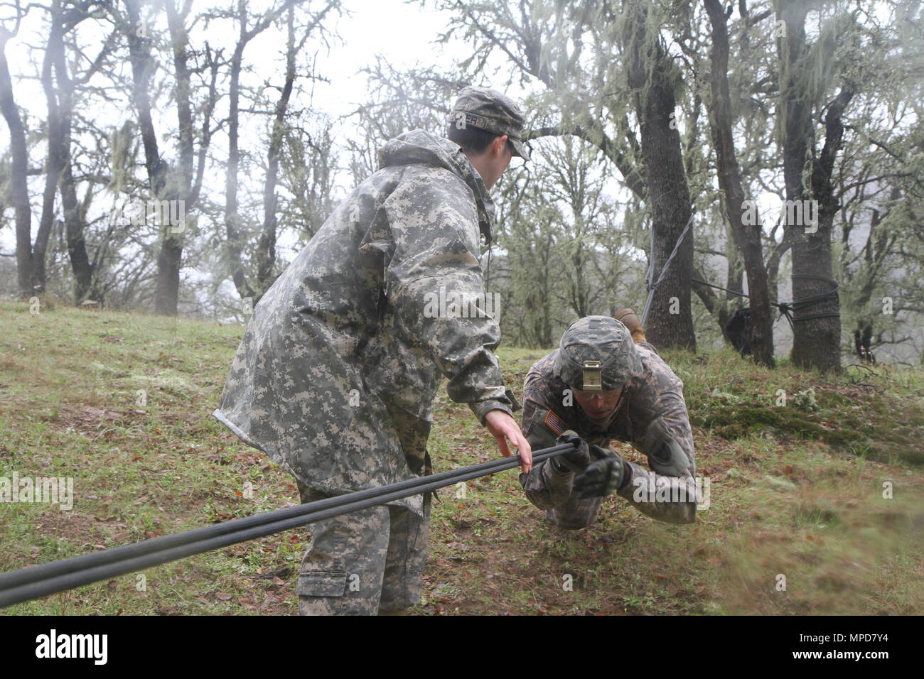 U.S. Army Reserve soldier Sfc. Corey Stevick crosses the rope crawl ...