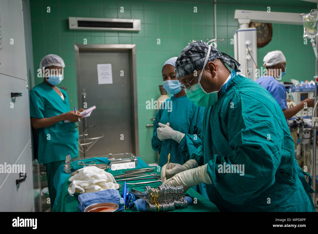 U.S. Army Staff Sgt. Stewart Lee, an operating room specialist assigned ...