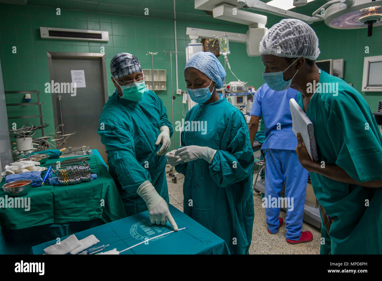 U.S. Army Staff Sgt. Stewart Lee, an operating room specialist assigned ...