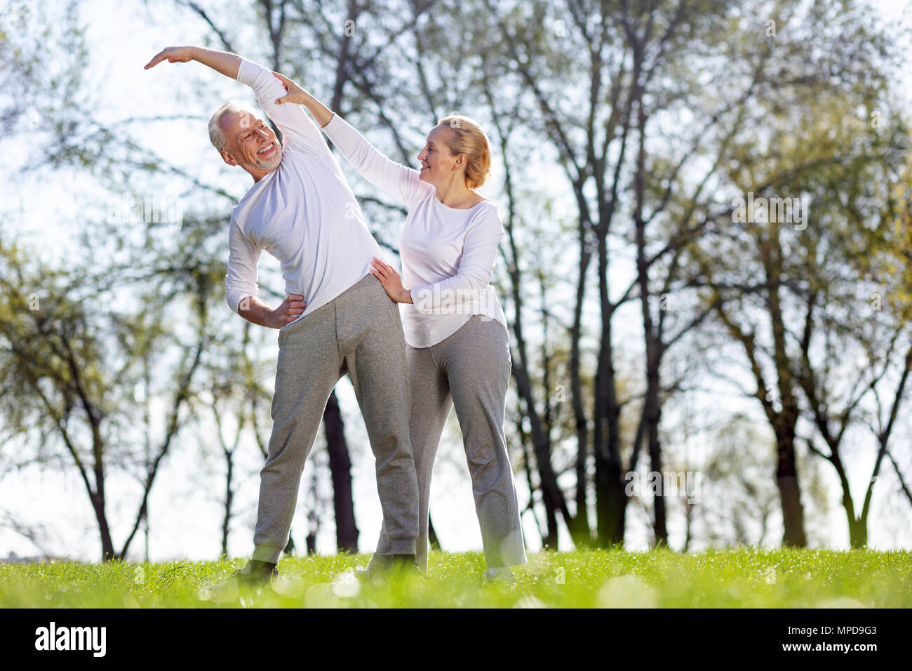 Positive active man doing an exercise Stock Photo - Alamy