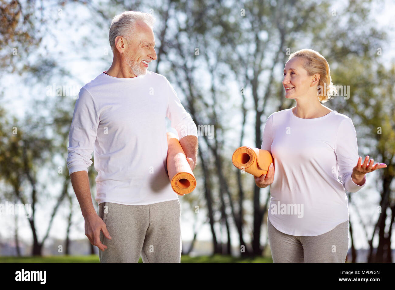 Joyful active people talking to each other Stock Photo - Alamy