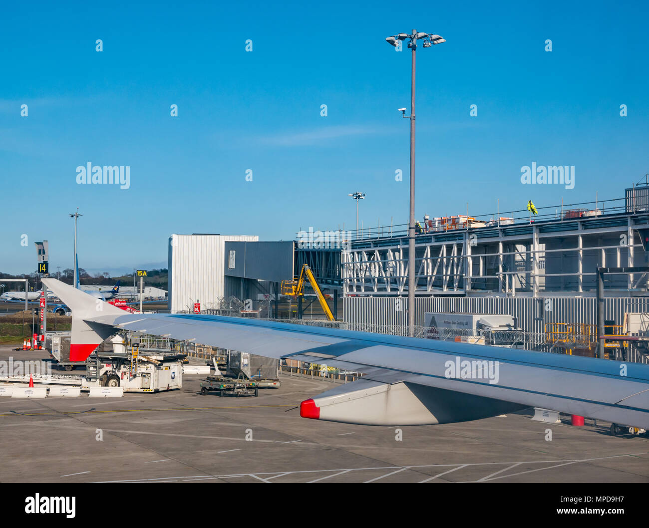 View from plane window of sky bridges at Edinburgh Airport, Scotland ...