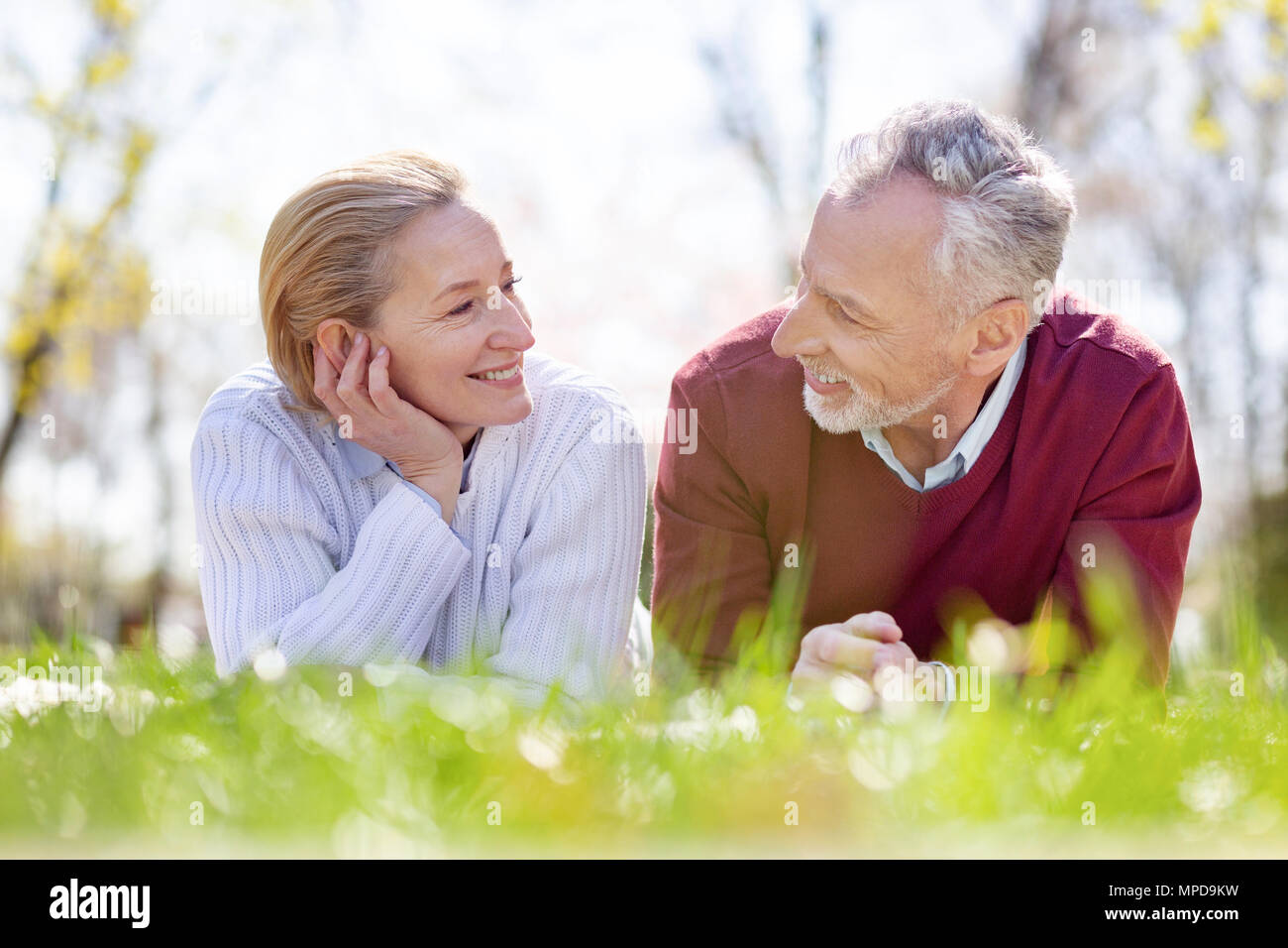 Happy nice people looking at each other Stock Photo - Alamy