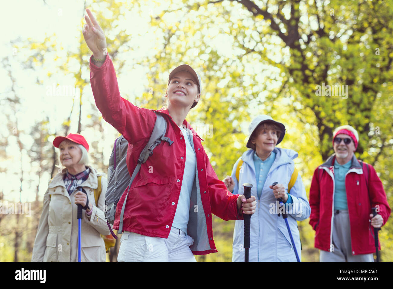 Joyful guide showing the way Stock Photo - Alamy