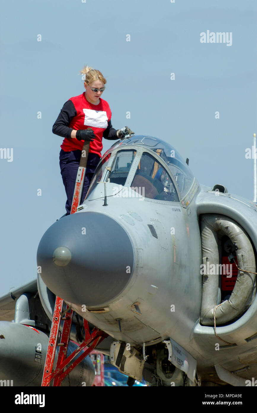 Female Royal Navy Fleet Air Arm ground crew engineer preparing a BAe ...