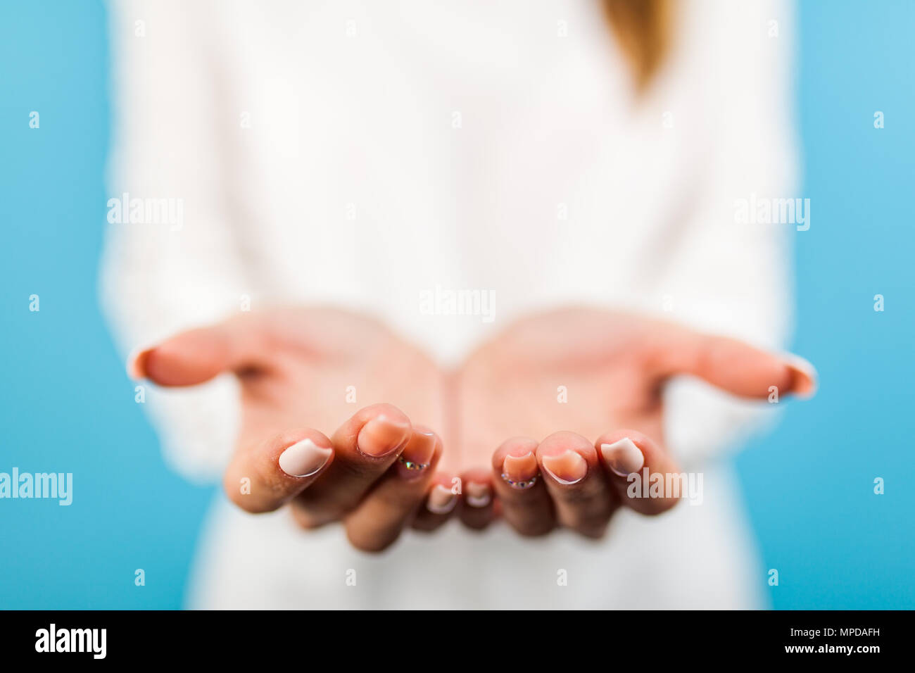 Beautiful female holding blue hi-res stock photography and images - Alamy