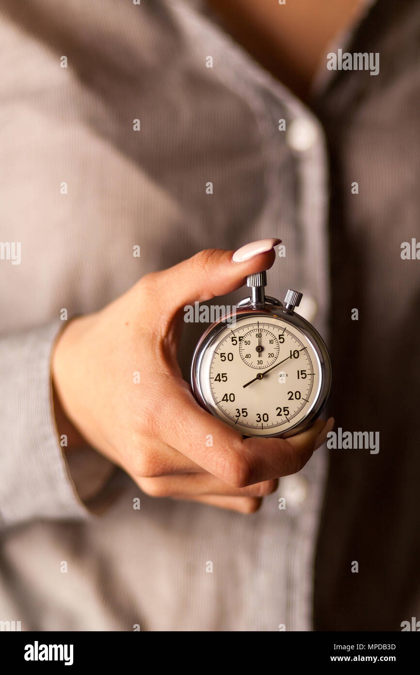 Hand holding stopwatch hi-res stock photography and images - Alamy