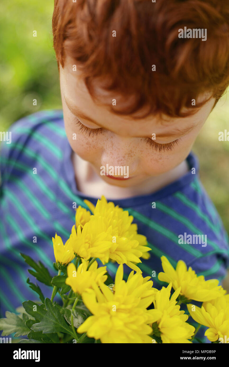 Boy planting flowers hi-res stock photography and images - Alamy