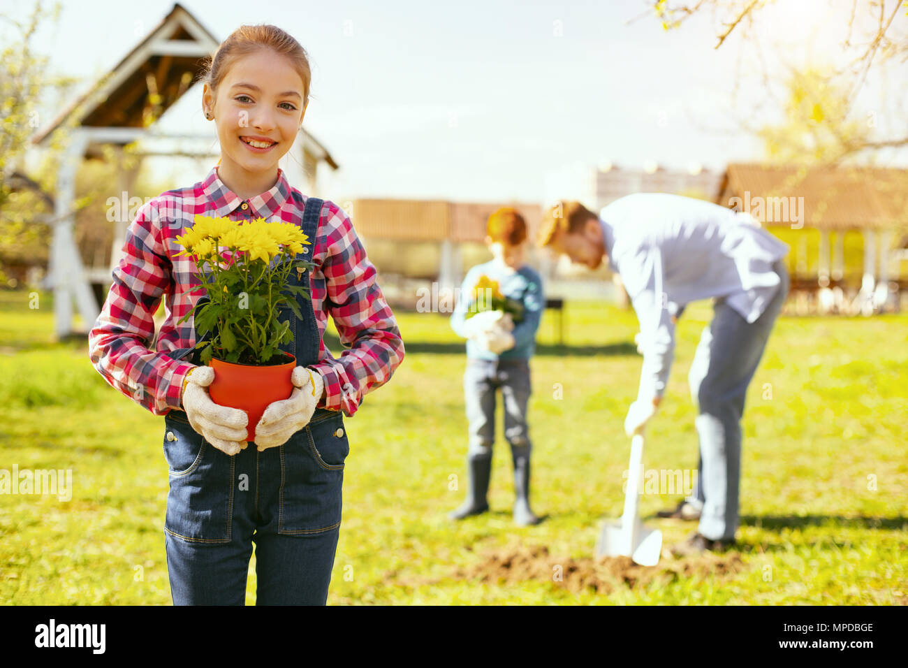 Nice happy girl holing flowers Stock Photo - Alamy