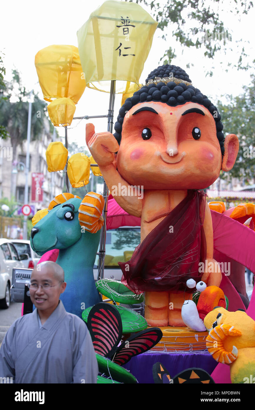 A carved out buddha styrofoam mounted on a buddhish procession vehicles ...