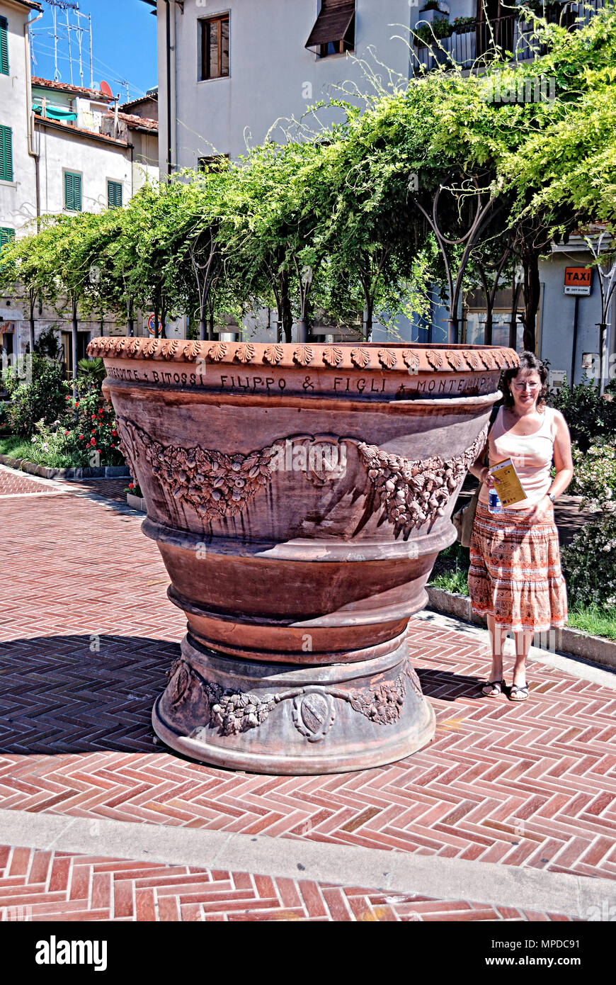 Enormous Flower Pot and Lady Stock Photo - Alamy