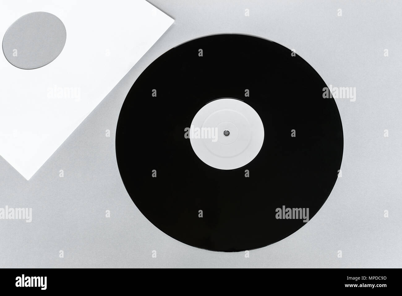 Vinyl LP on gray background surface with copy free space and white ...