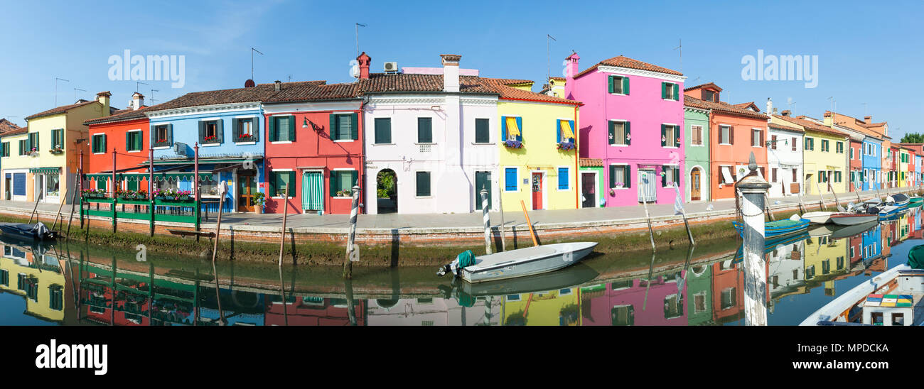 Panorama of colourful houses on a canal in the fishing village on Burano Island, Venice, Veneto ...