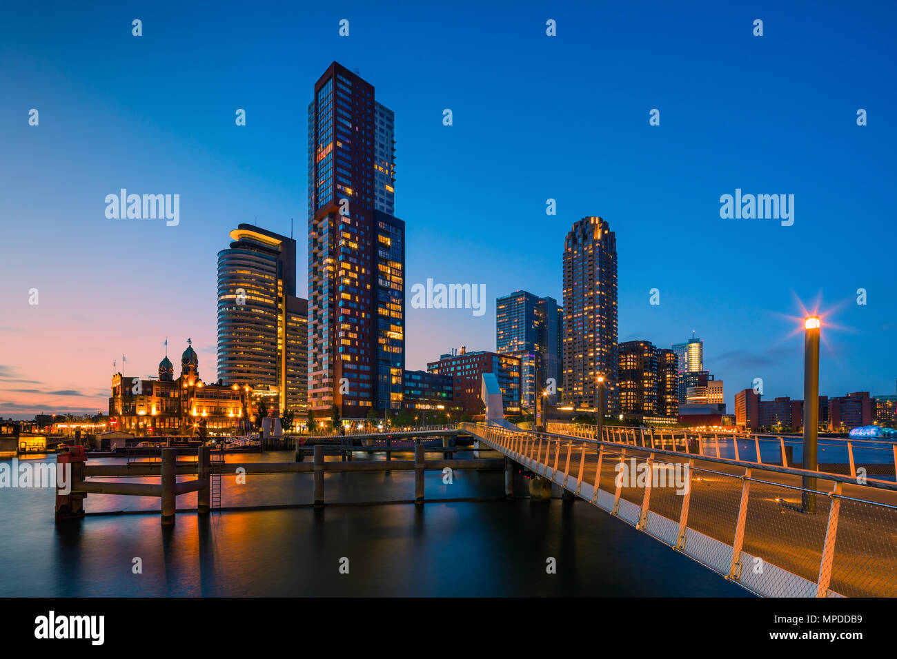 Downtown Rotterdam at twilight with a small part of it’s skyline as ...
