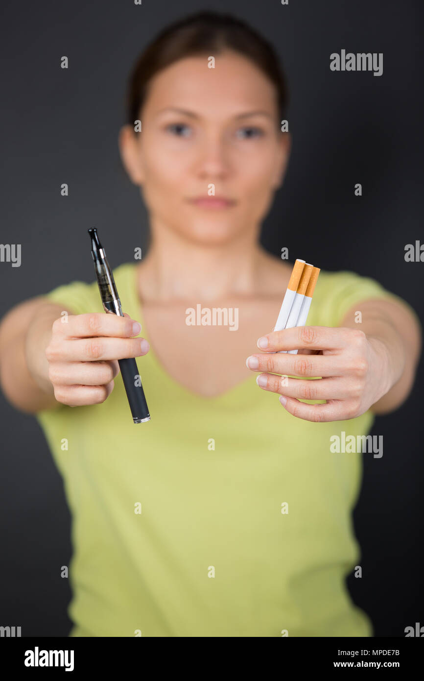 electronic cigarette versus normal cigarette concept Stock Photo - Alamy