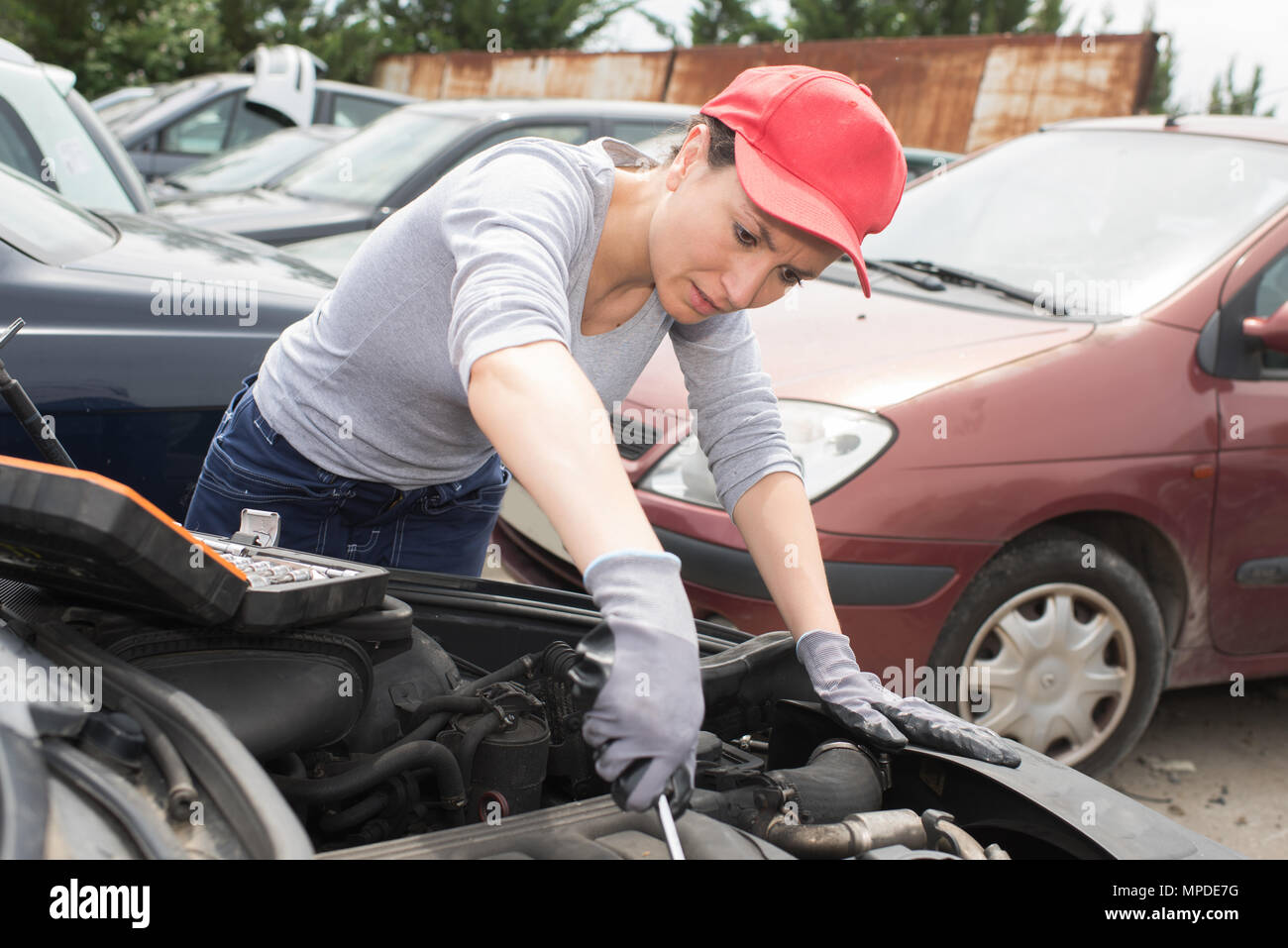 female mechanic working on car engine Stock Photo - Alamy