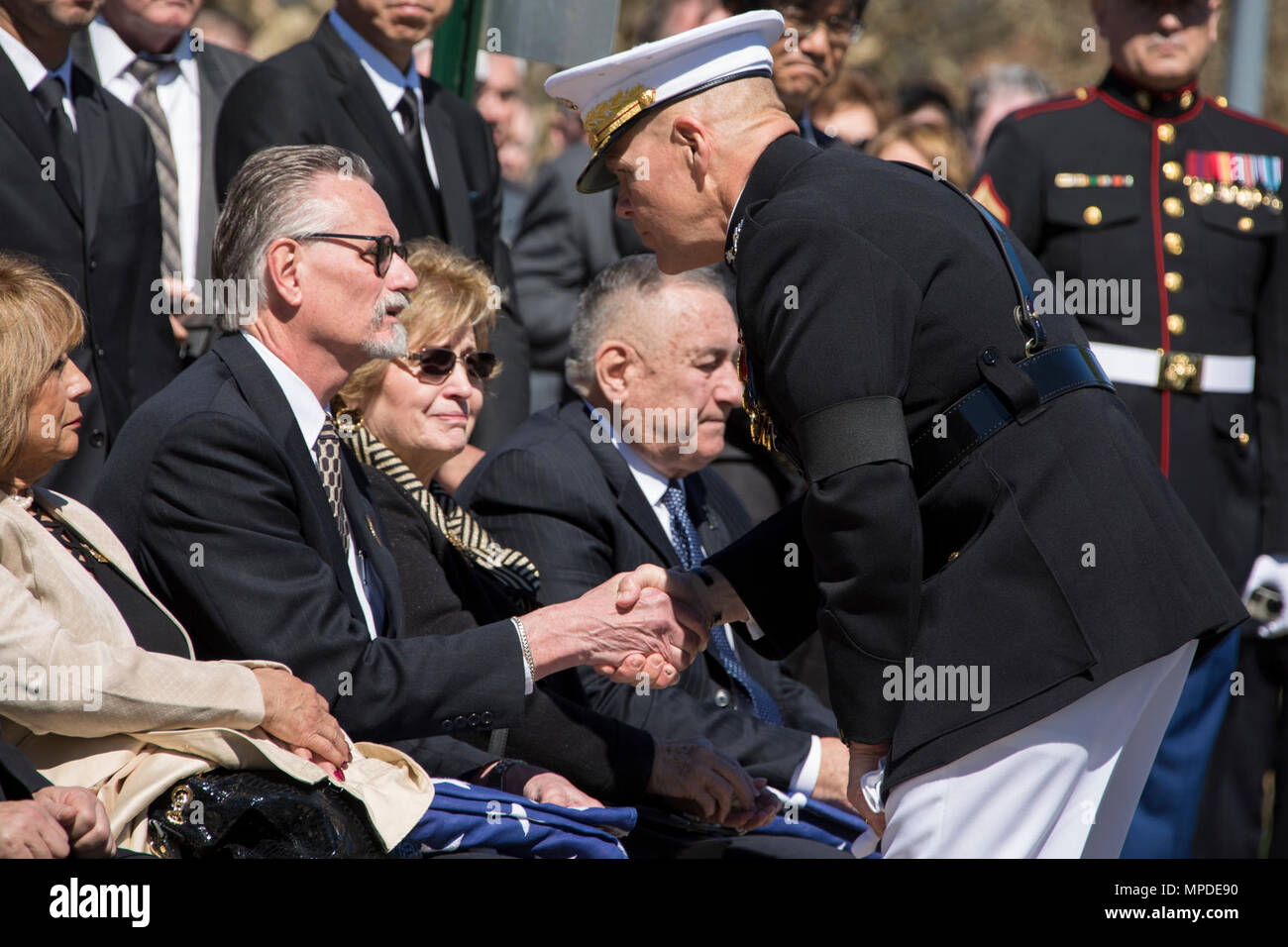 Commandant of the Marine Corps Gen. Robert B. Neller, right, shakes ...