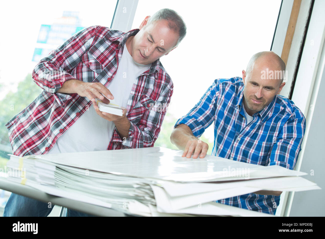 Pile papers person hi-res stock photography and images - Alamy