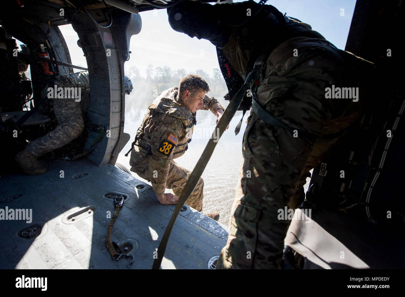 U.S. Army Rangers jump into Victory Pond from a UH-60 Black Hawk ...