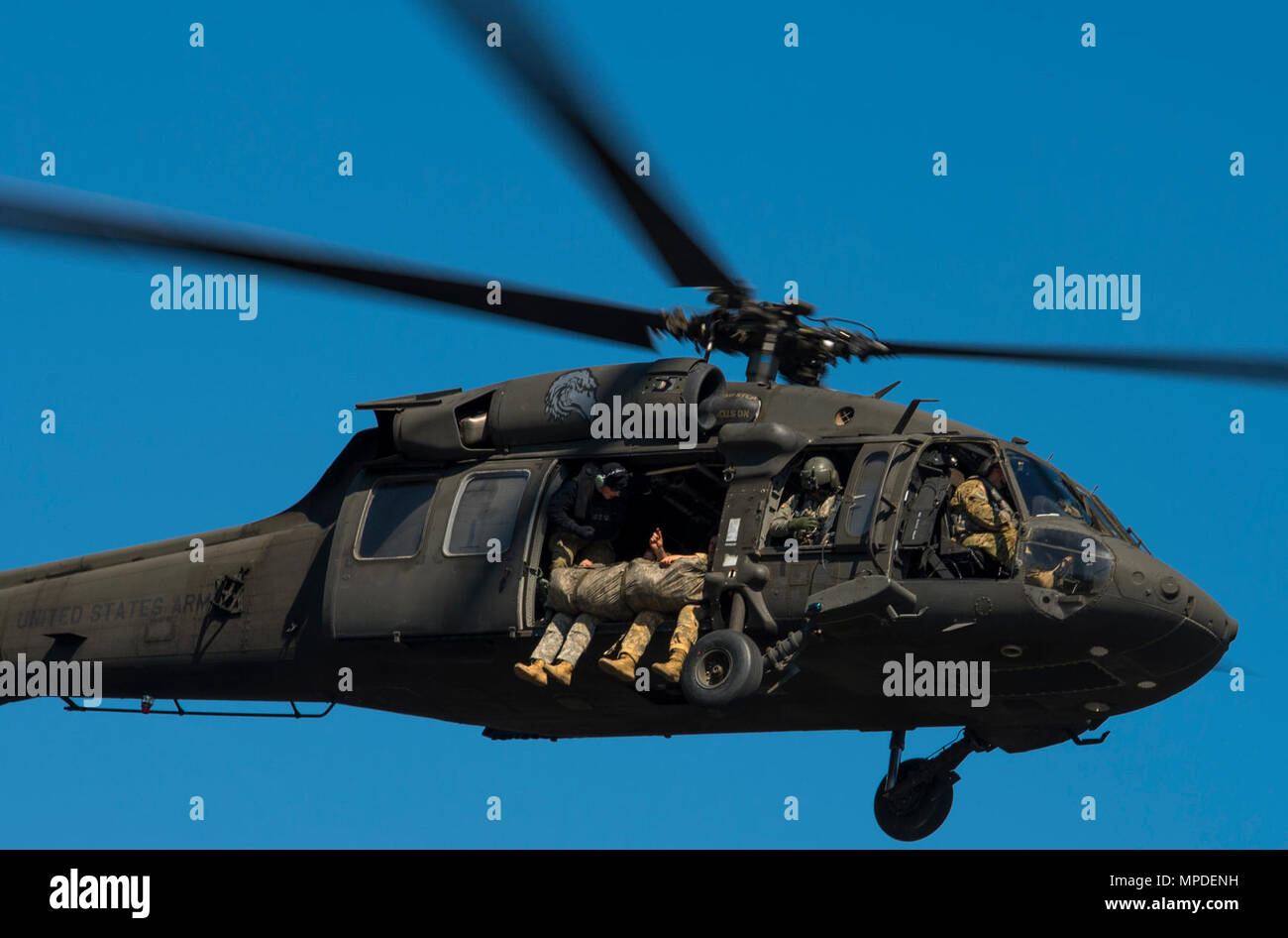 U.S. Army Rangers wait to jump off a UH-60 Black Hawk helicopter over ...