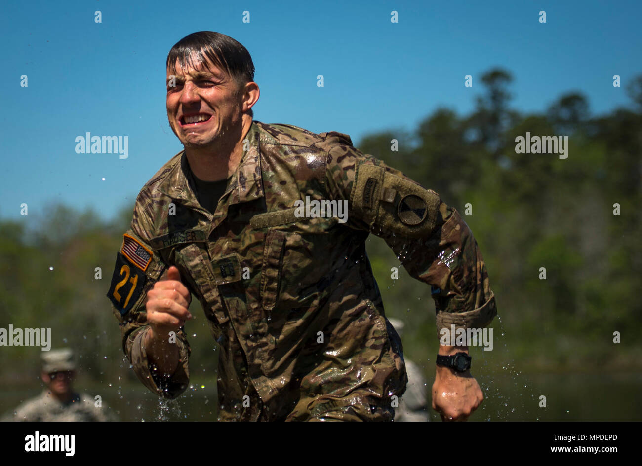 U.S. Army Capt. Michael Hauser, a 7th Infantry Division Ranger, runs to ...