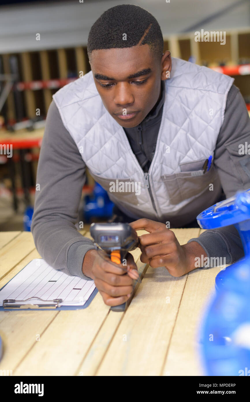 worker man with warehouse barcode scanner Stock Photo - Alamy