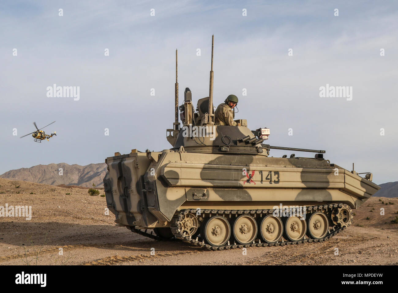 FORT IRWIN, Calif. – A UH-72 Lakota Helicopter passes by an OPFOR ...
